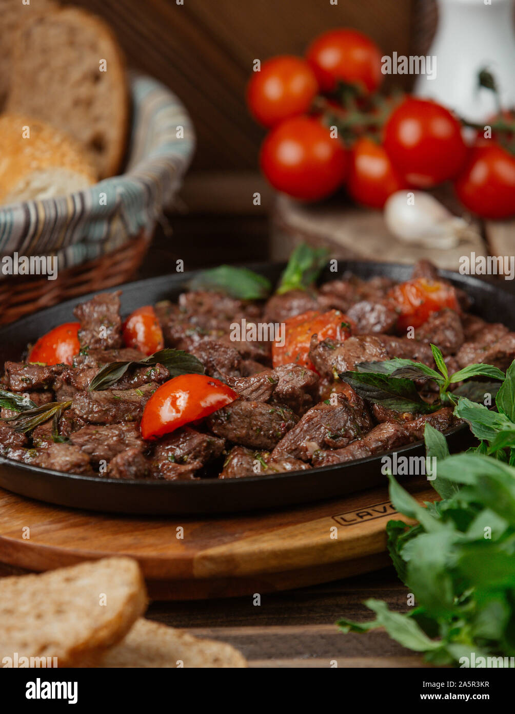 marinated beef slices garnished with tarragon and tomato Stock Photo ...