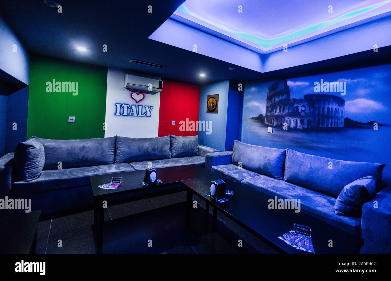 private restautant room with italian flag, coliseum picture and sofas Stock Photo - Alamy