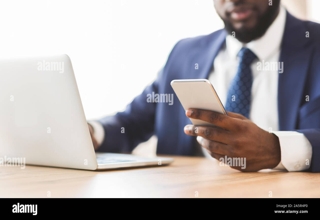 Close up of businessman using cellphone at workplace Stock Photo - Alamy
