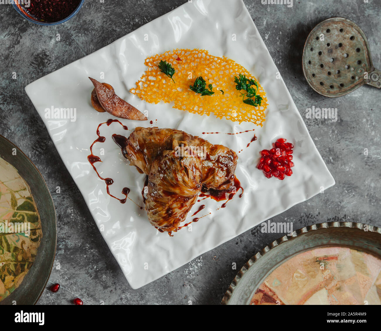 stuffed cabbage dolma garnished with sauce Stock Photo - Alamy