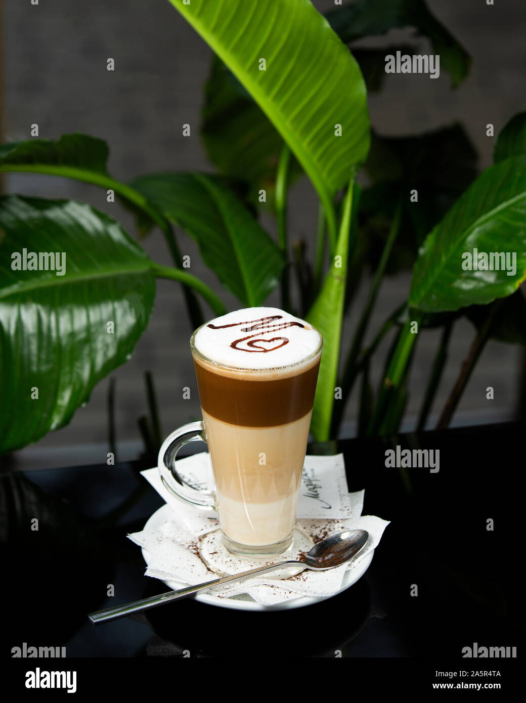 three layered latte with letter latte art on top Stock Photo - Alamy