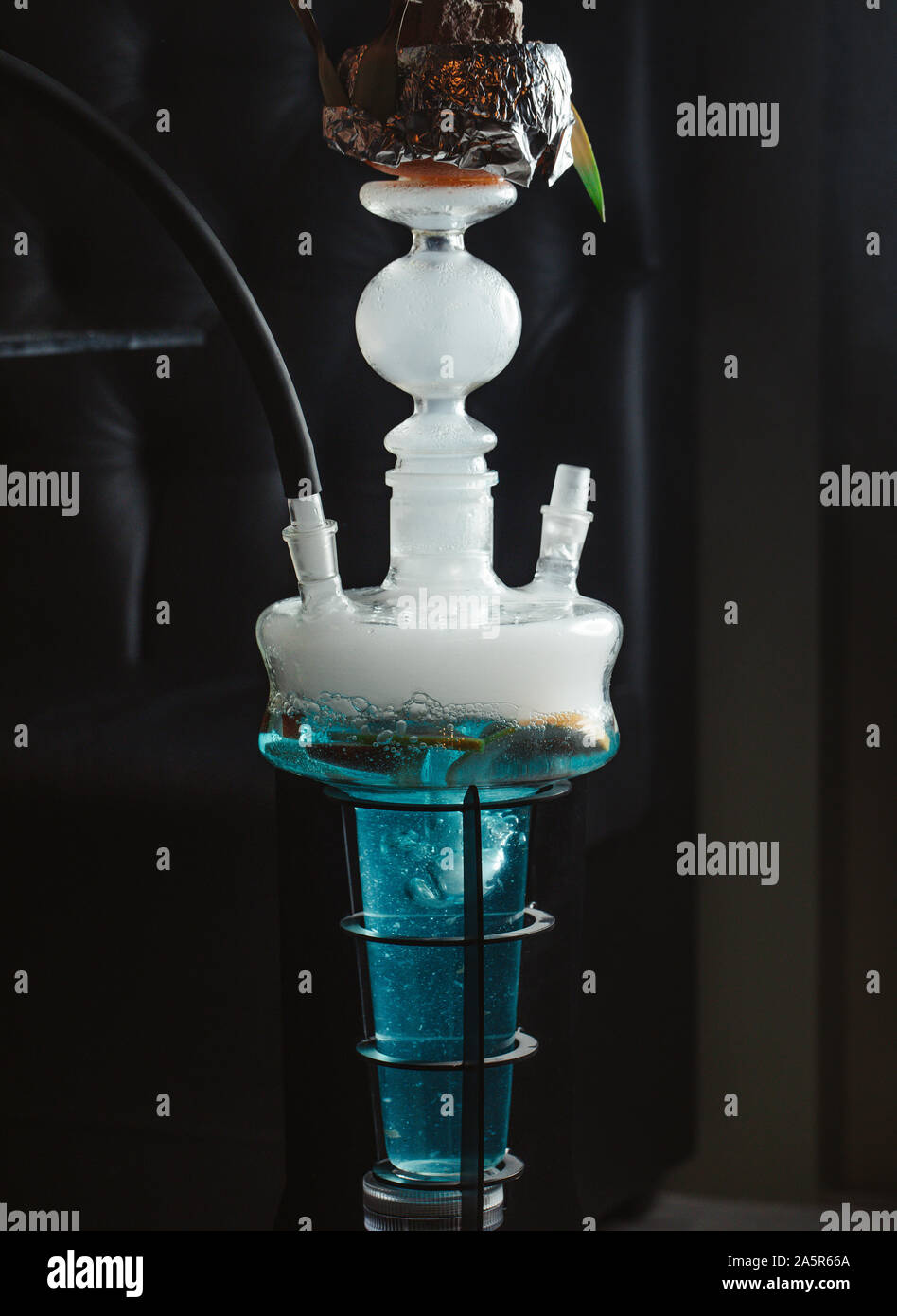 close up of hookah stand with blue water and orange slices Stock Photo ...