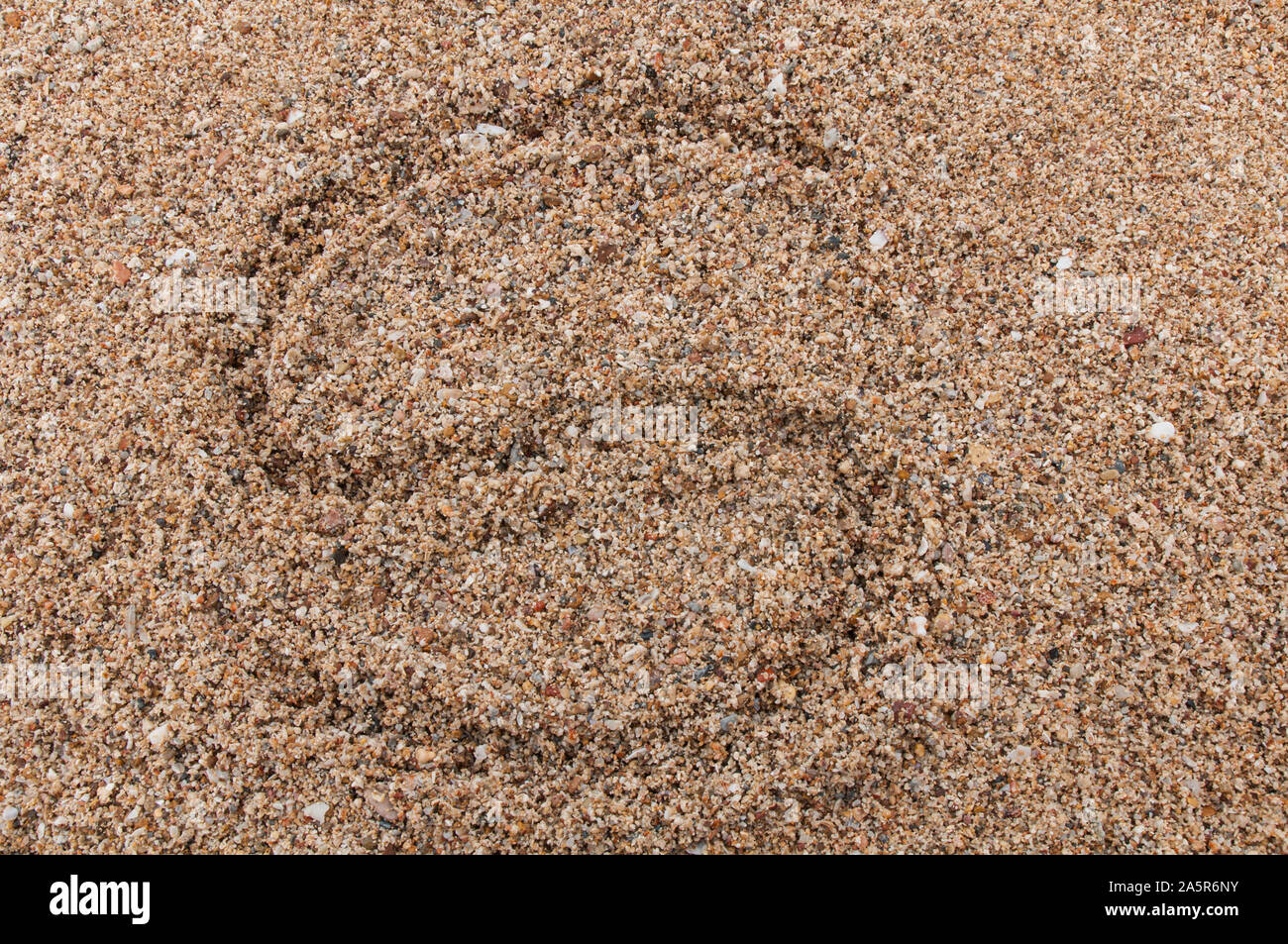 Character S of the alphabet writing on the sand Stock Photo - Alamy