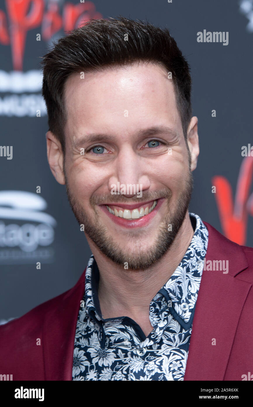 Sven KROLL, TV presenter, posing with two vampire performers, Red ...