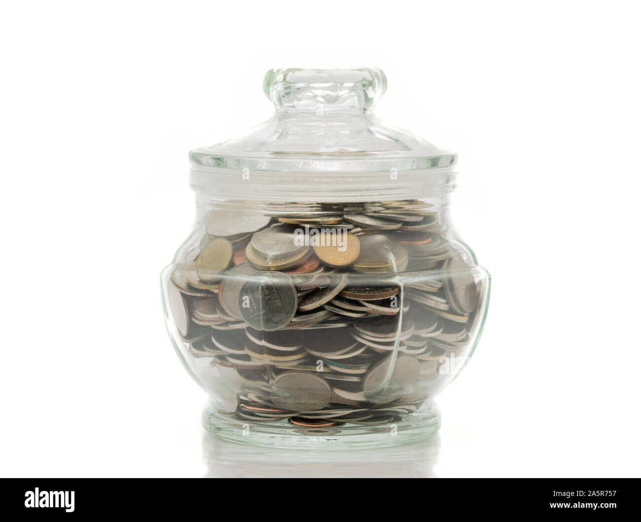 Bath coins in a glass jar with lid on white background Stock Photo - Alamy