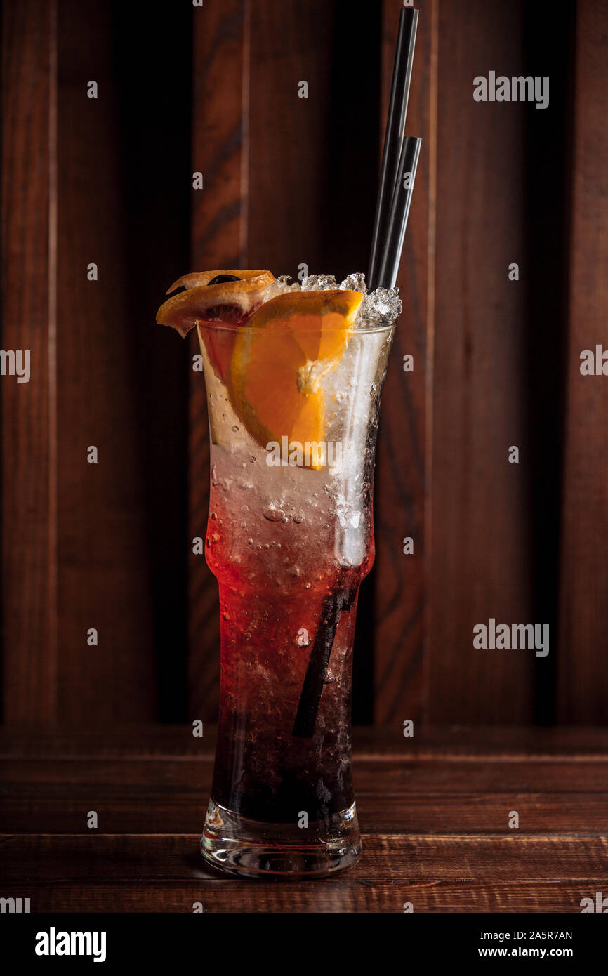glass of fruit drink with ice and orange slices Stock Photo - Alamy