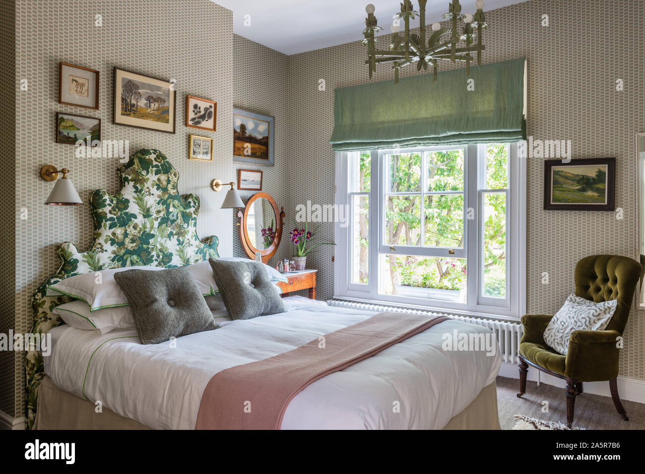 Floral headboard at open window in Victorian terrace renovation Stock ...