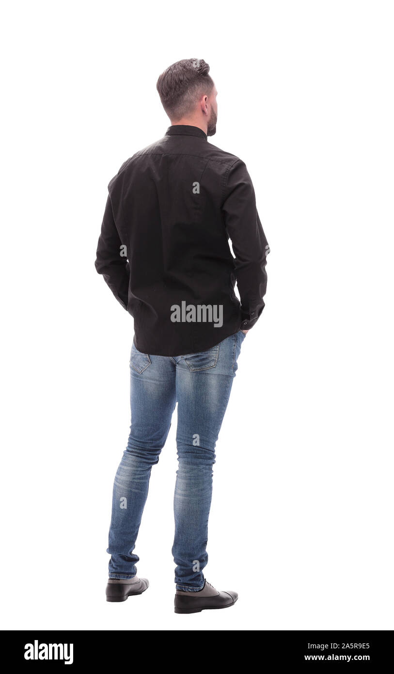 rear view. young man in jeans looking forward Stock Photo - Alamy