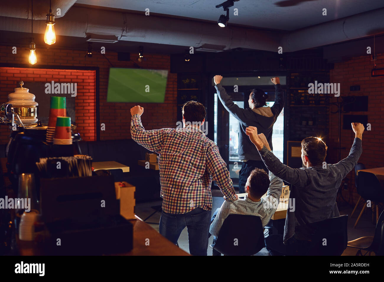 Football fans pub back view hi-res stock photography and images - Alamy