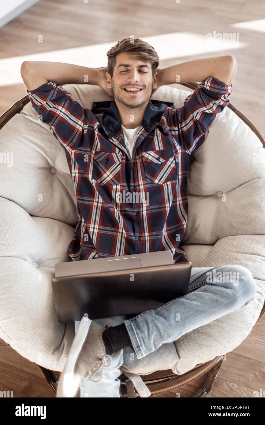close up. tired guy dozing sitting in front of an open laptop Stock ...