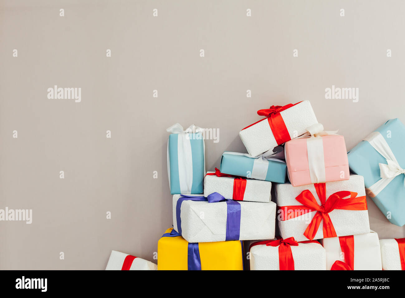 birthday presents on a grey background holliday Stock Photo - Alamy