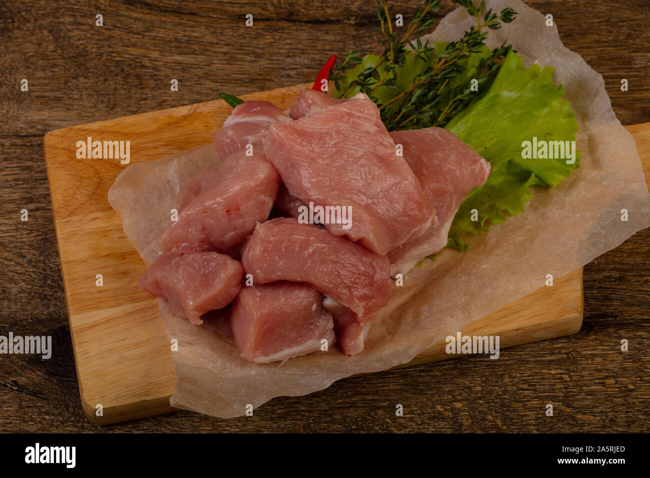 Raw pork meat heap for roast Stock Photo - Alamy