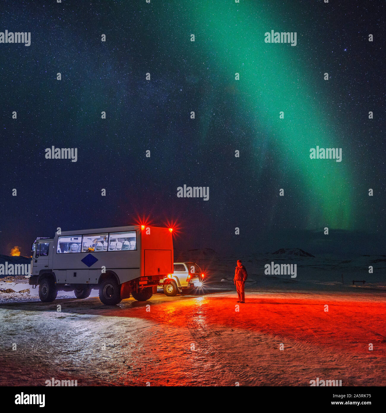 Aurora Borealis, Iceland Man and bus with Aurora Borealis, Lake Myvatn ...