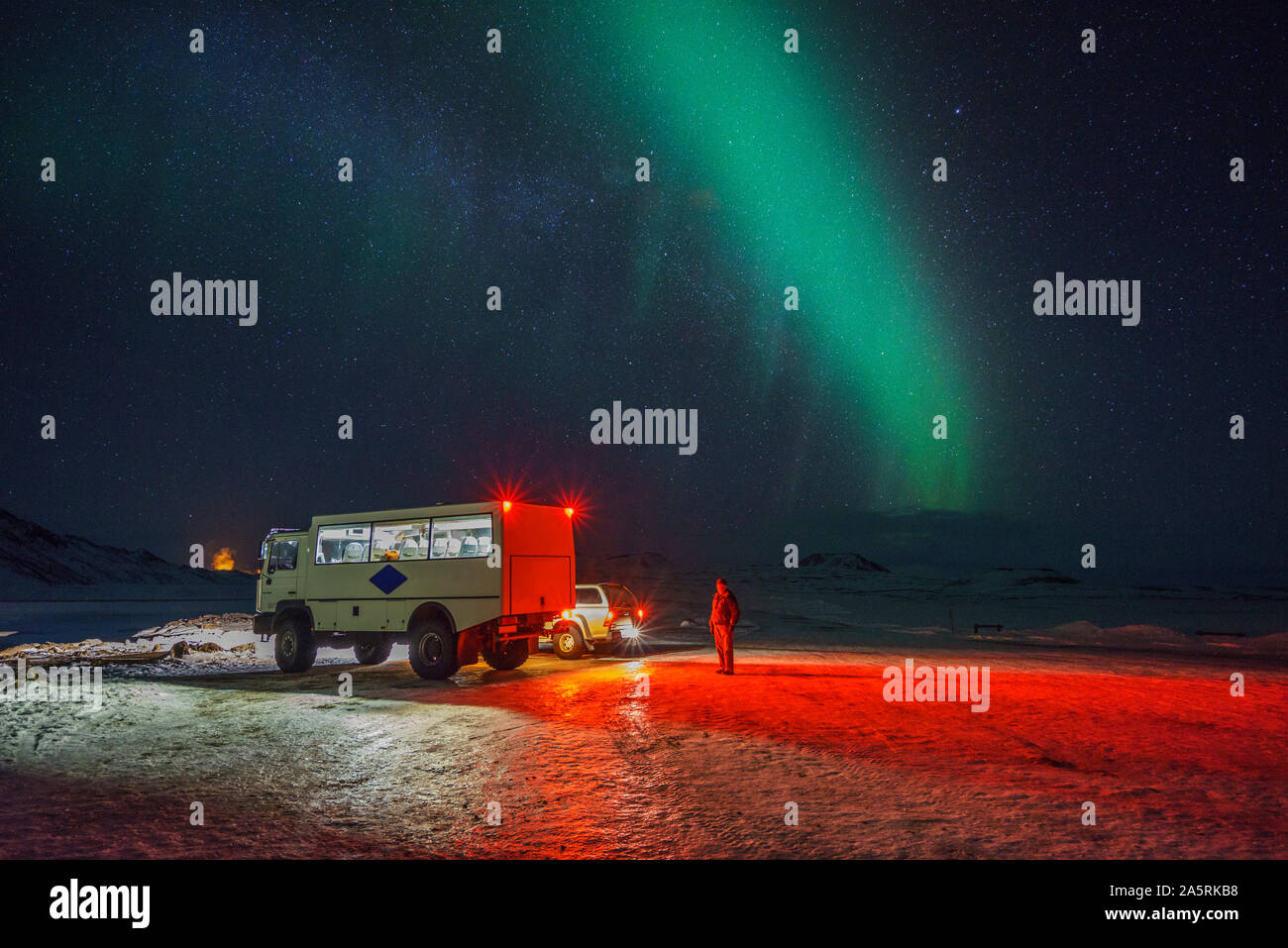 Aurora Borealis, Iceland Man and bus with Aurora Borealis, Lake Myvatn ...