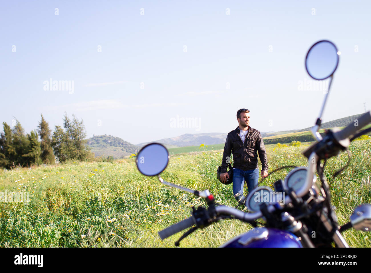 Man carrying motorcycle helmet hi-res stock photography and images - Alamy