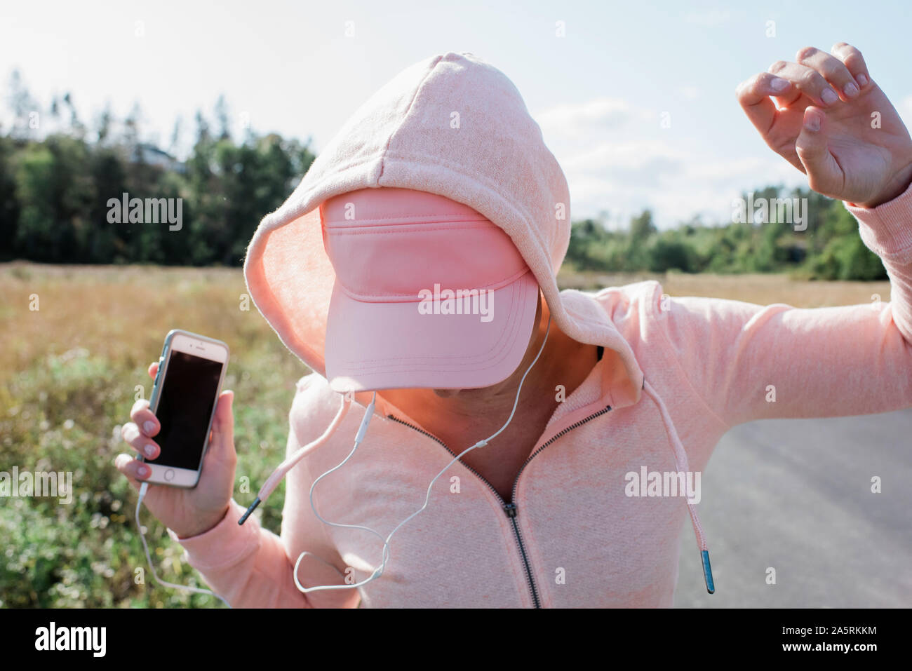 Happy woman dancing mobile phone hi-res stock photography and images ...