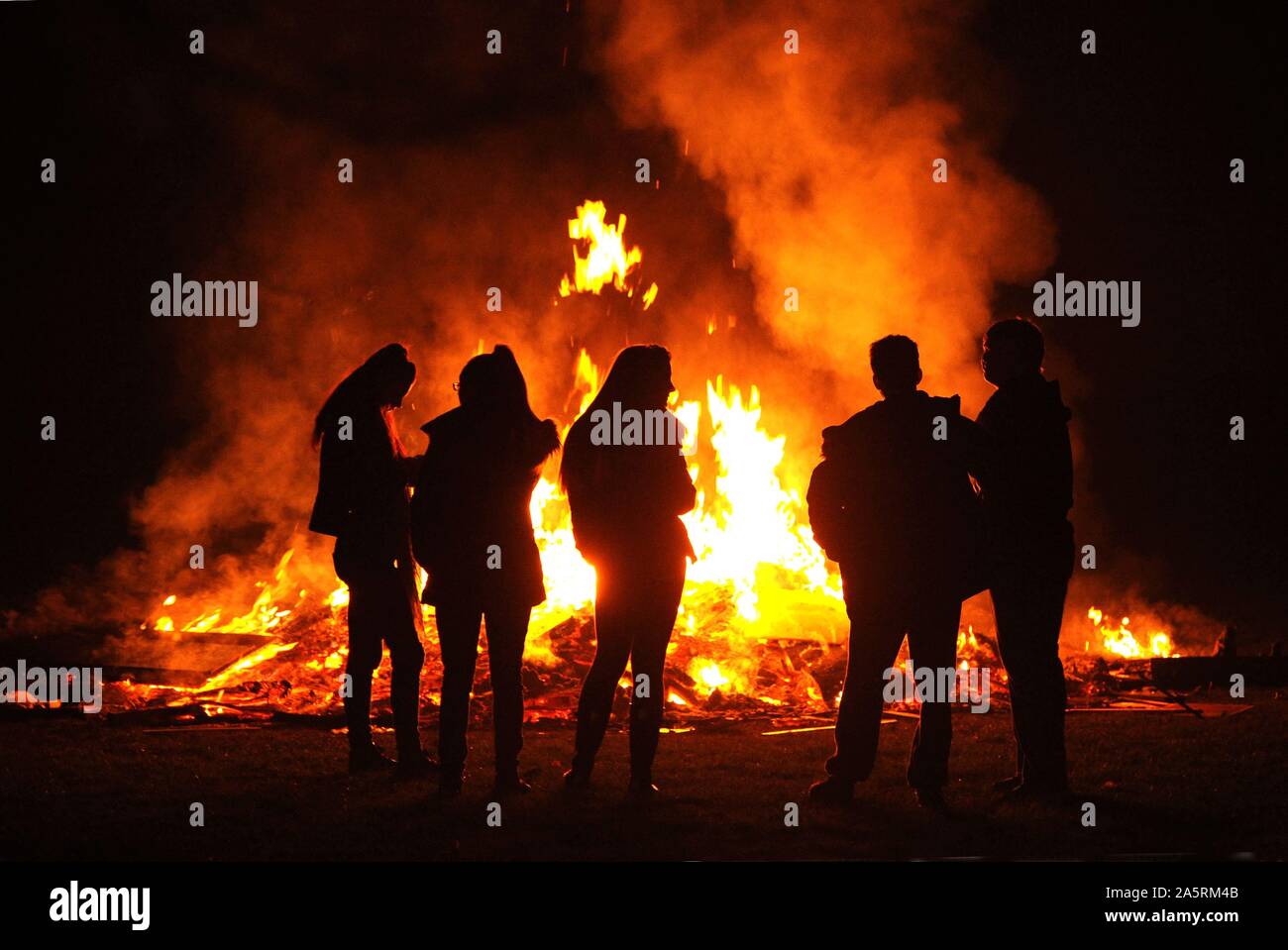 Bonfire night in Liverpool. Youths standing around a bonfire in ...