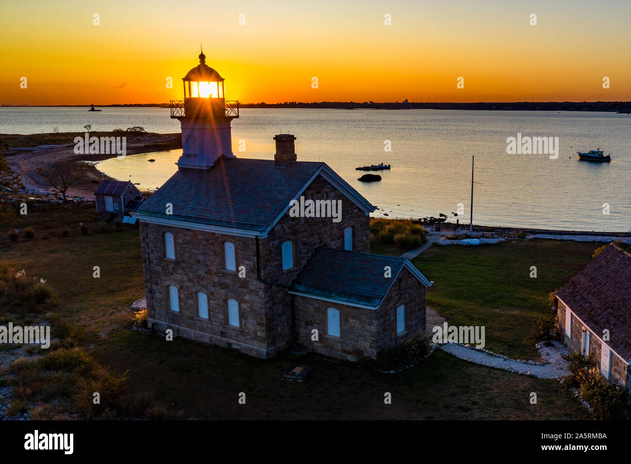 The Sheffield Island lighthouse at sunset Stock Photo - Alamy