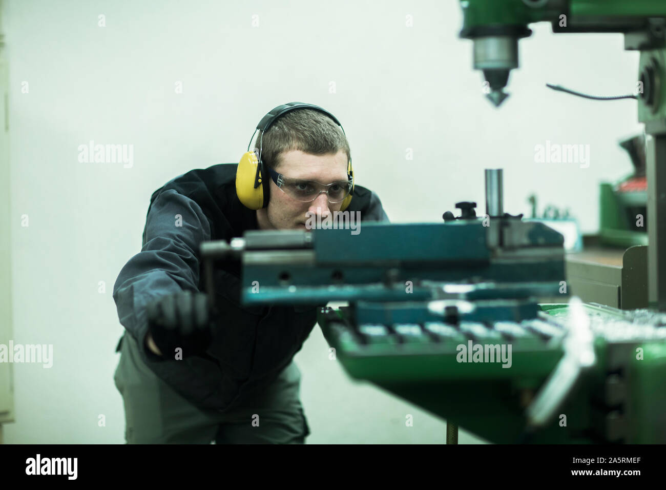 engineer in a workshop milling a tool Stock Photo - Alamy