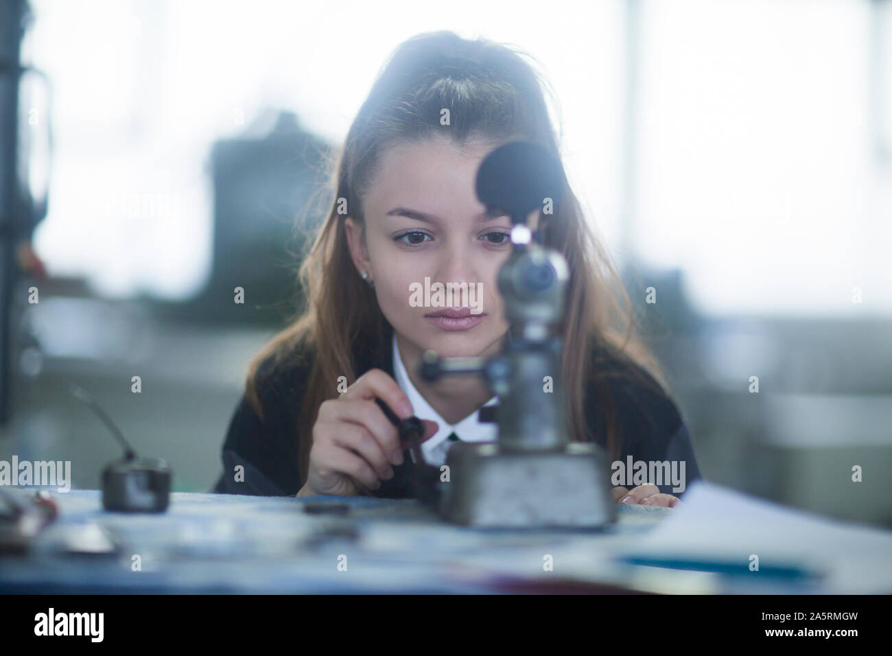 industrial plant with an engineer female chiching a tool Stock Photo ...