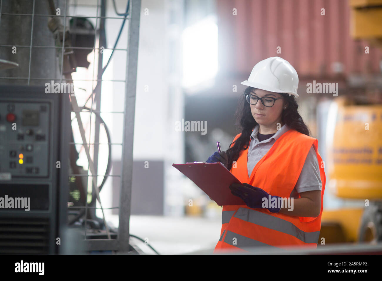 storekeeper female in a warehouse Stock Photo - Alamy
