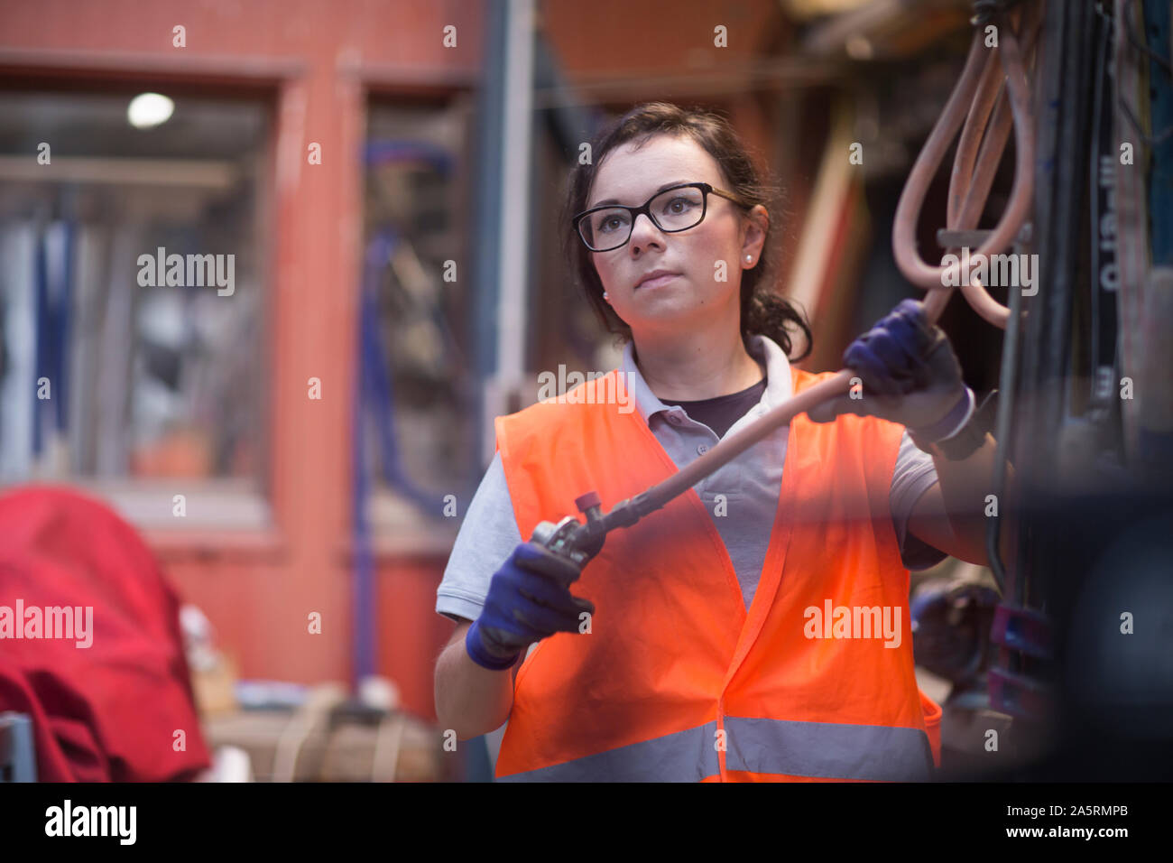 storekeeper female in a warehouse Stock Photo - Alamy