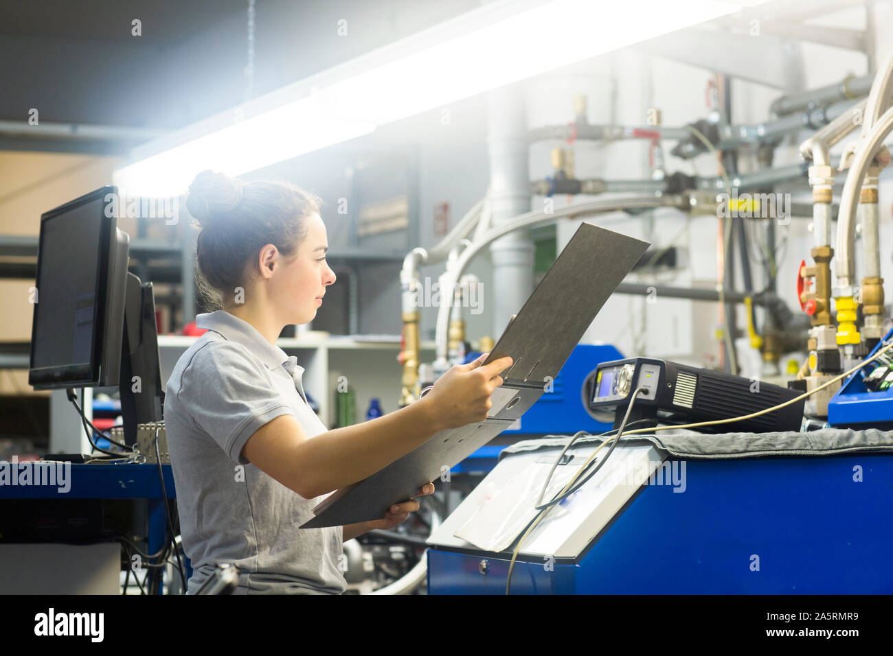 block heat and power plant engineer female Stock Photo - Alamy