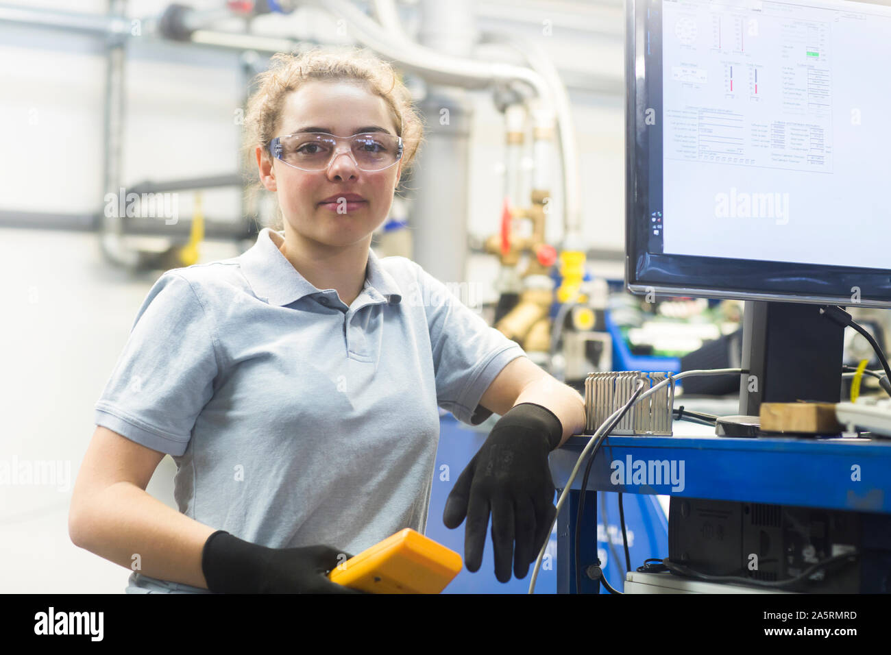block heat and power plant engineer female Stock Photo - Alamy