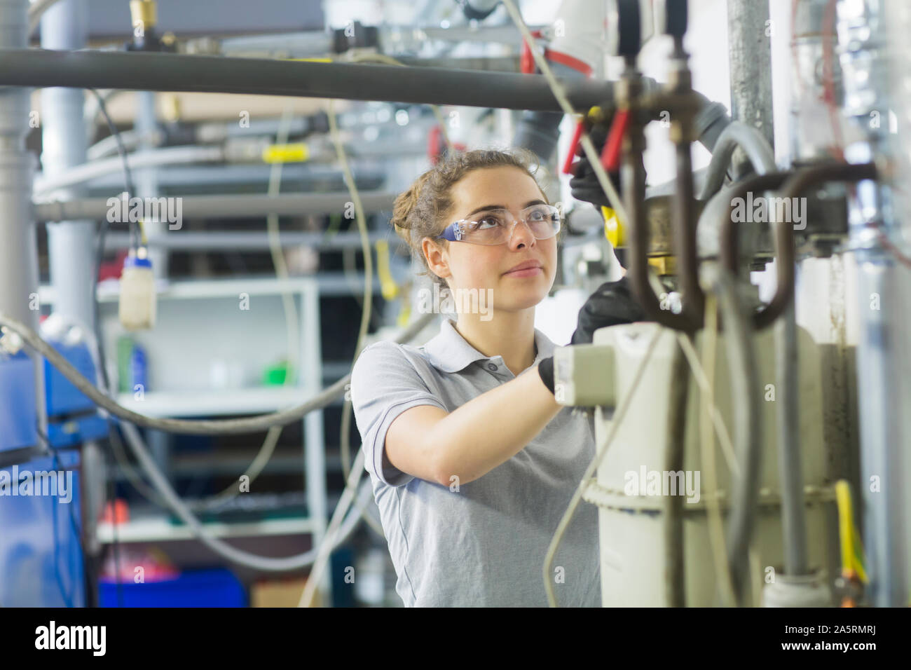block heat and power plant engineer female Stock Photo - Alamy