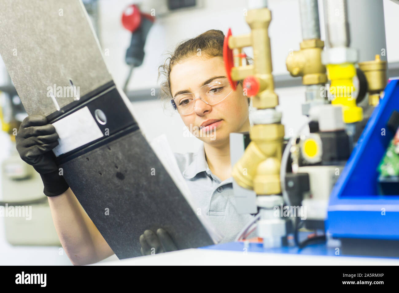 block heat and power plant engineer female Stock Photo - Alamy