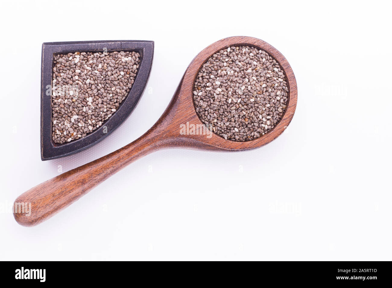 chia beans in container on white background Stock Photo - Alamy