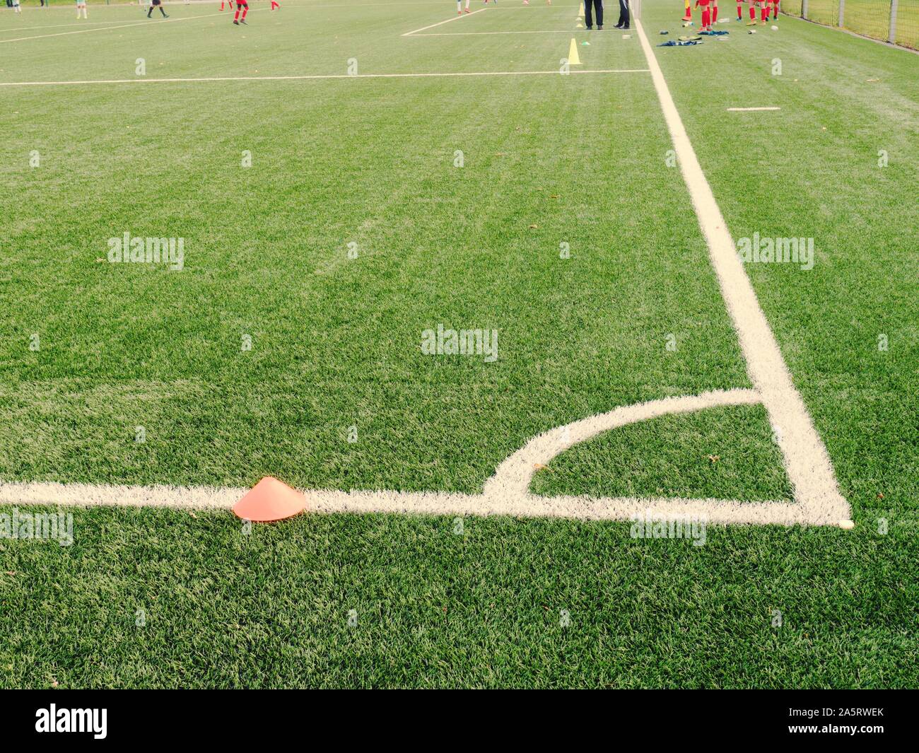 Soccer training equipment. Green artificial turf with blurry kid ...