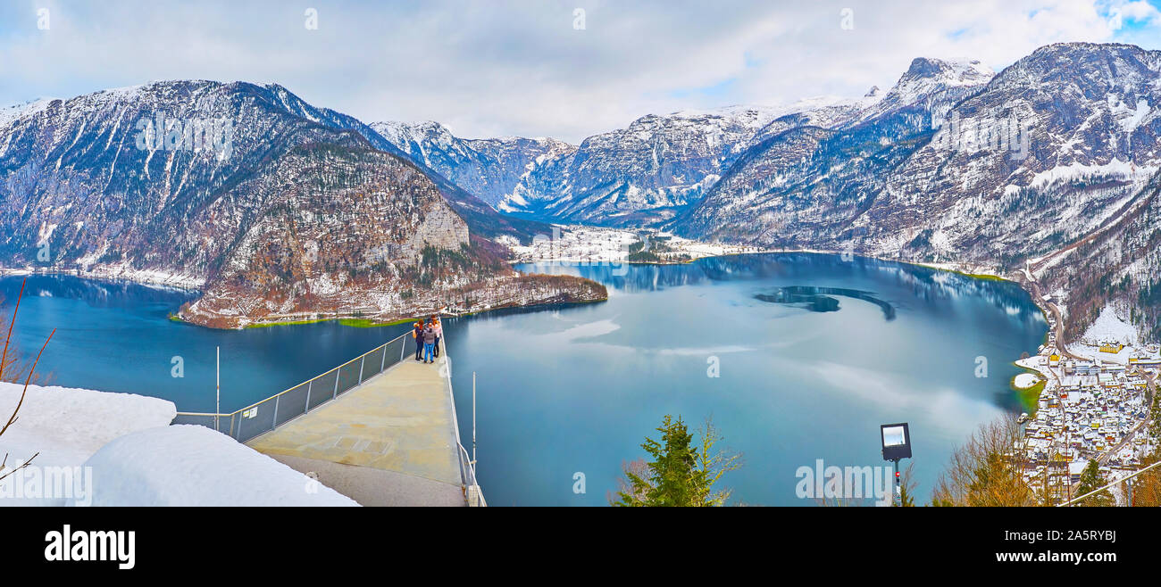 HALLSTATT, AUSTRIA - FEBRUARY 21, 2019: Tourists enjoy the Alpine ...