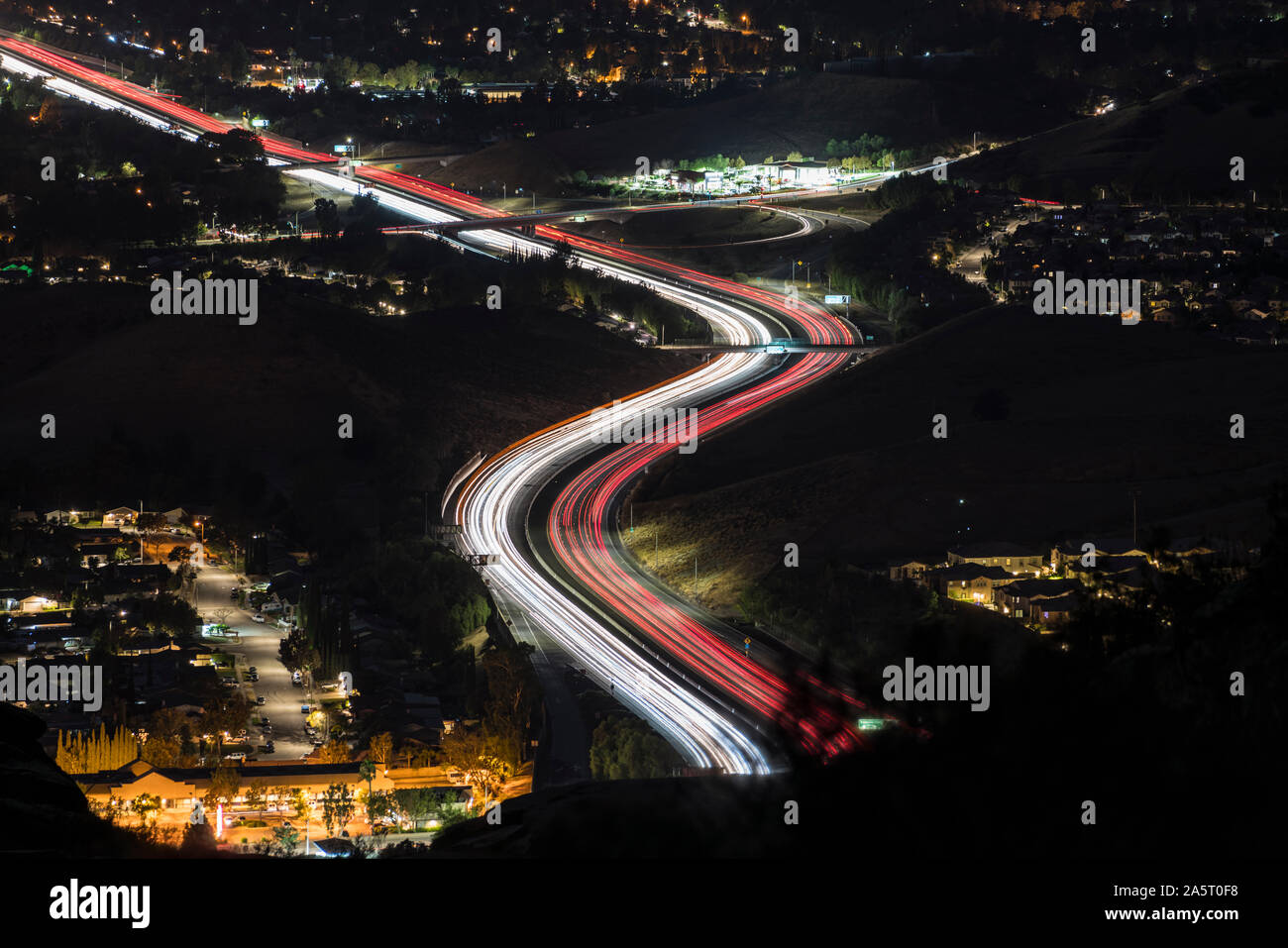 Los Angeles night freeway commuters on route 118 below the Santa Susana ...