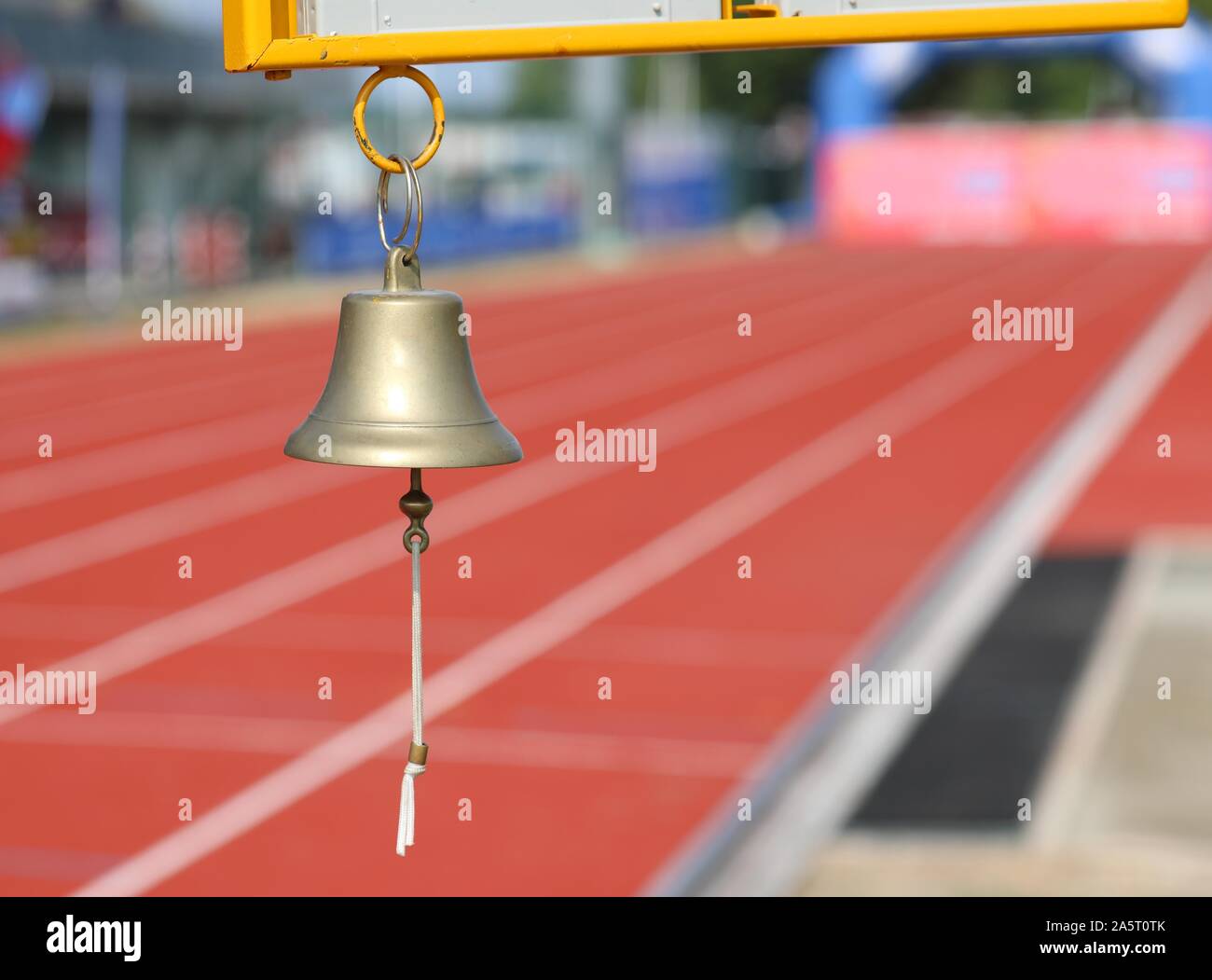 bell at the side of an athletics track to indicate to the athletes the ...
