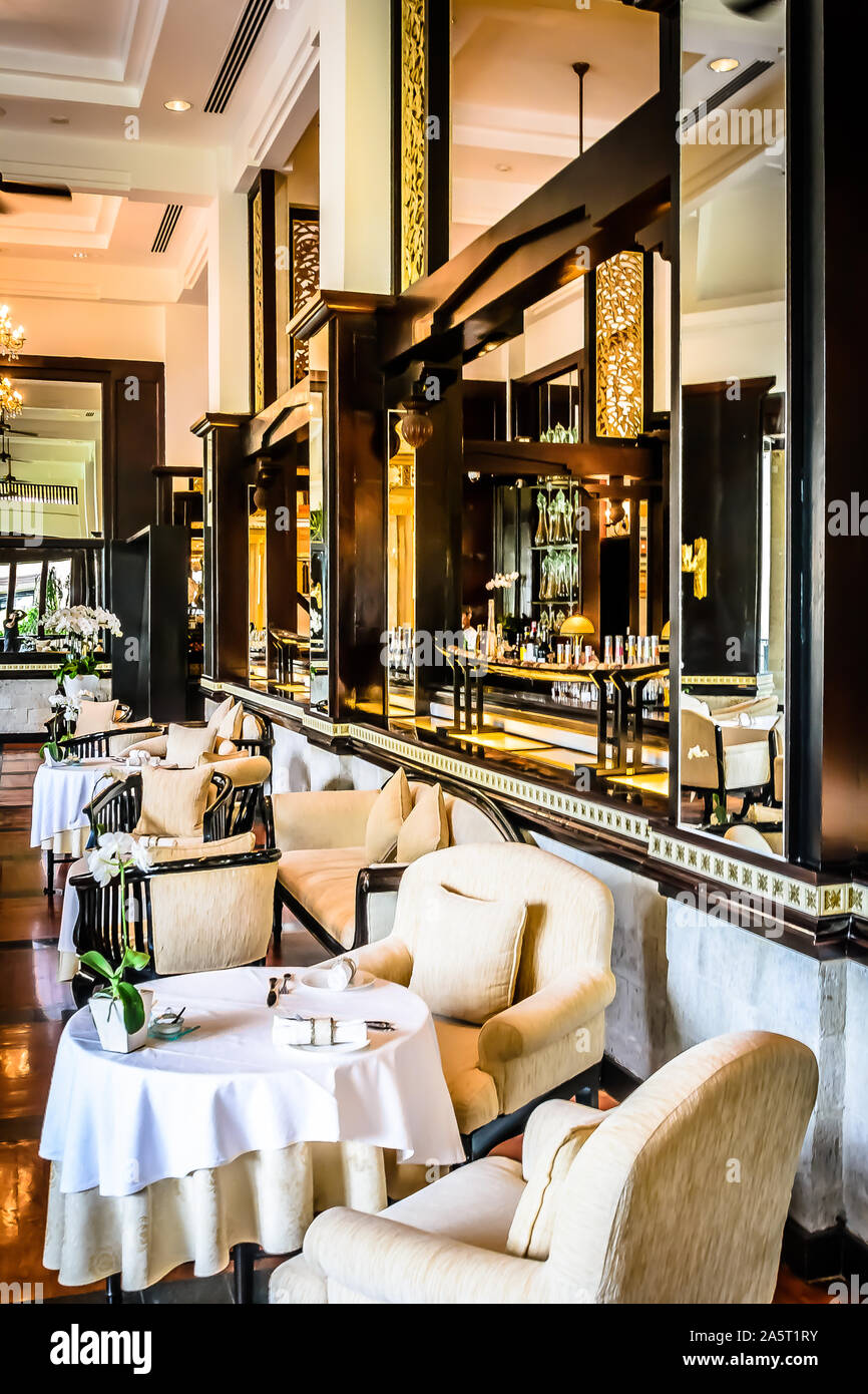 beautiful restaurant with white linen table cloths, white linen napkins ...