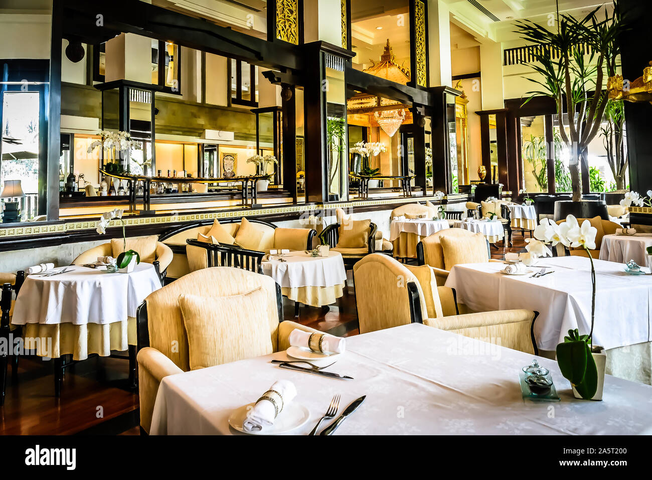 beautiful restaurant with white linen table cloths, white linen napkins ...