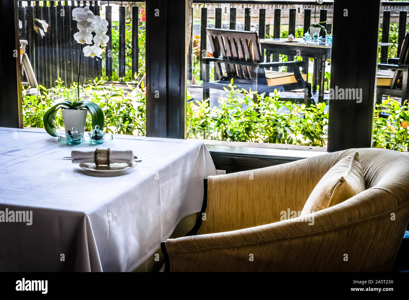 beautiful restaurant with white linen table cloths, white linen napkins ...