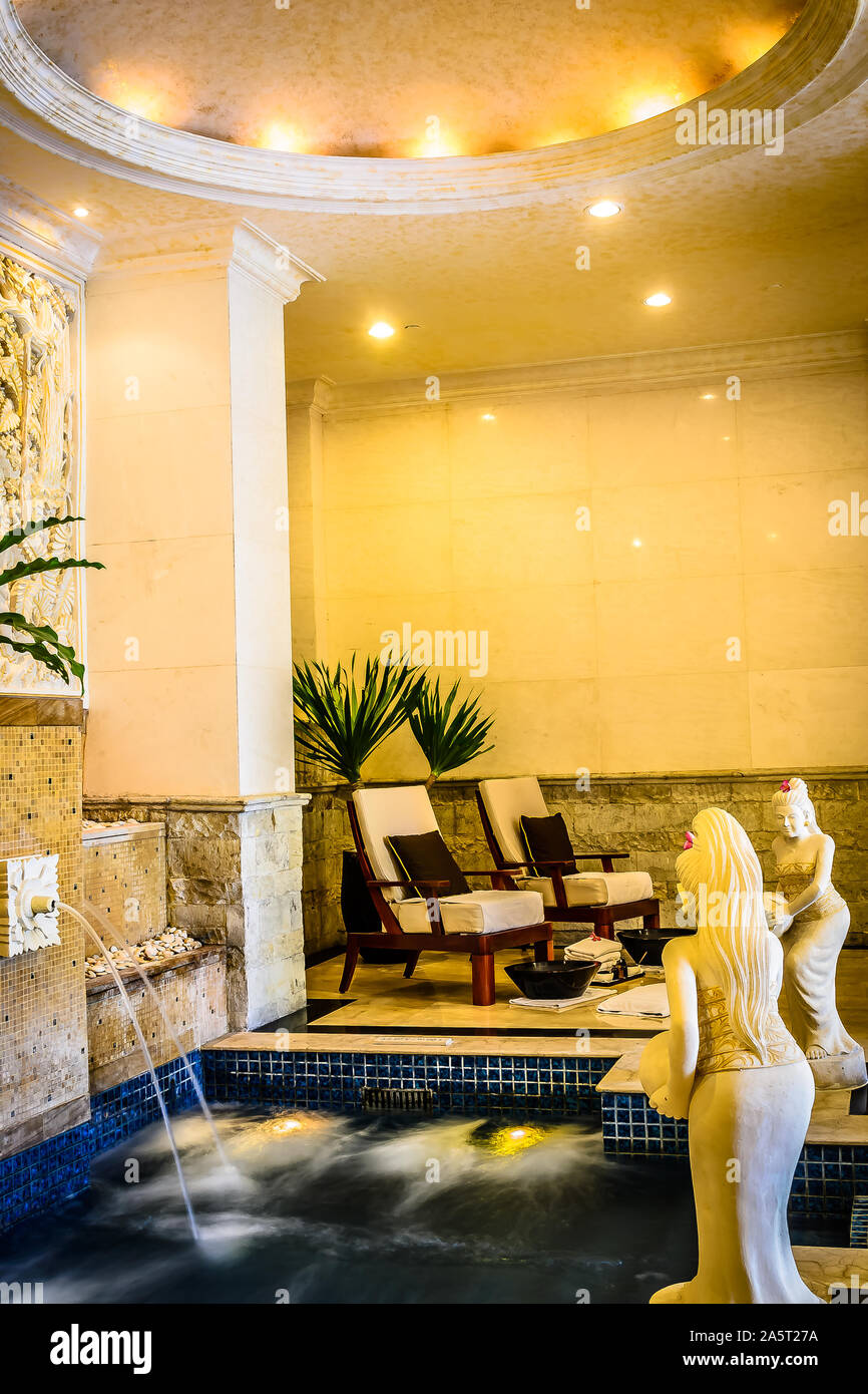 high class luxury spa with sculptures and fountains and lounge chairs ...