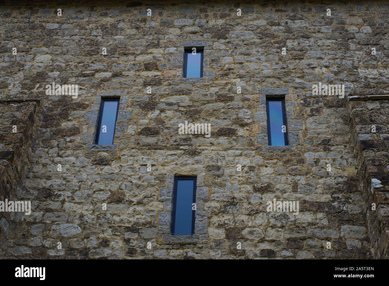 four windows on a building Stock Photo - Alamy