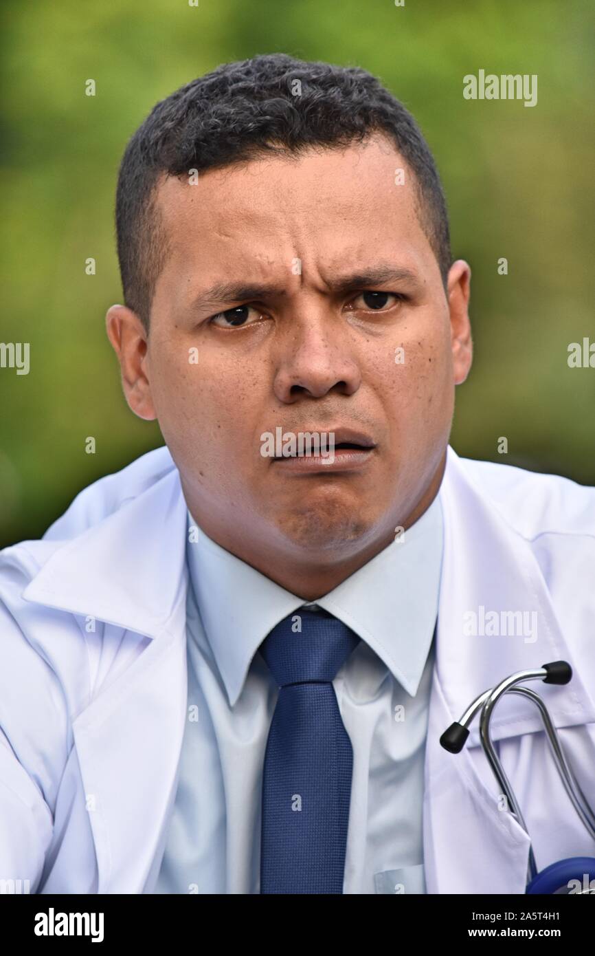 Confused Handsome Male Surgeon Wearing Lab Coat Stock Photo - Alamy