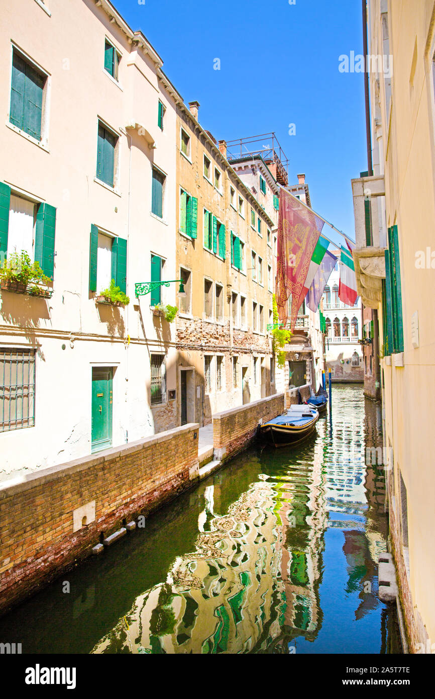 Amazing view to the narrow canal in Venice, Italy. Old buildings ...