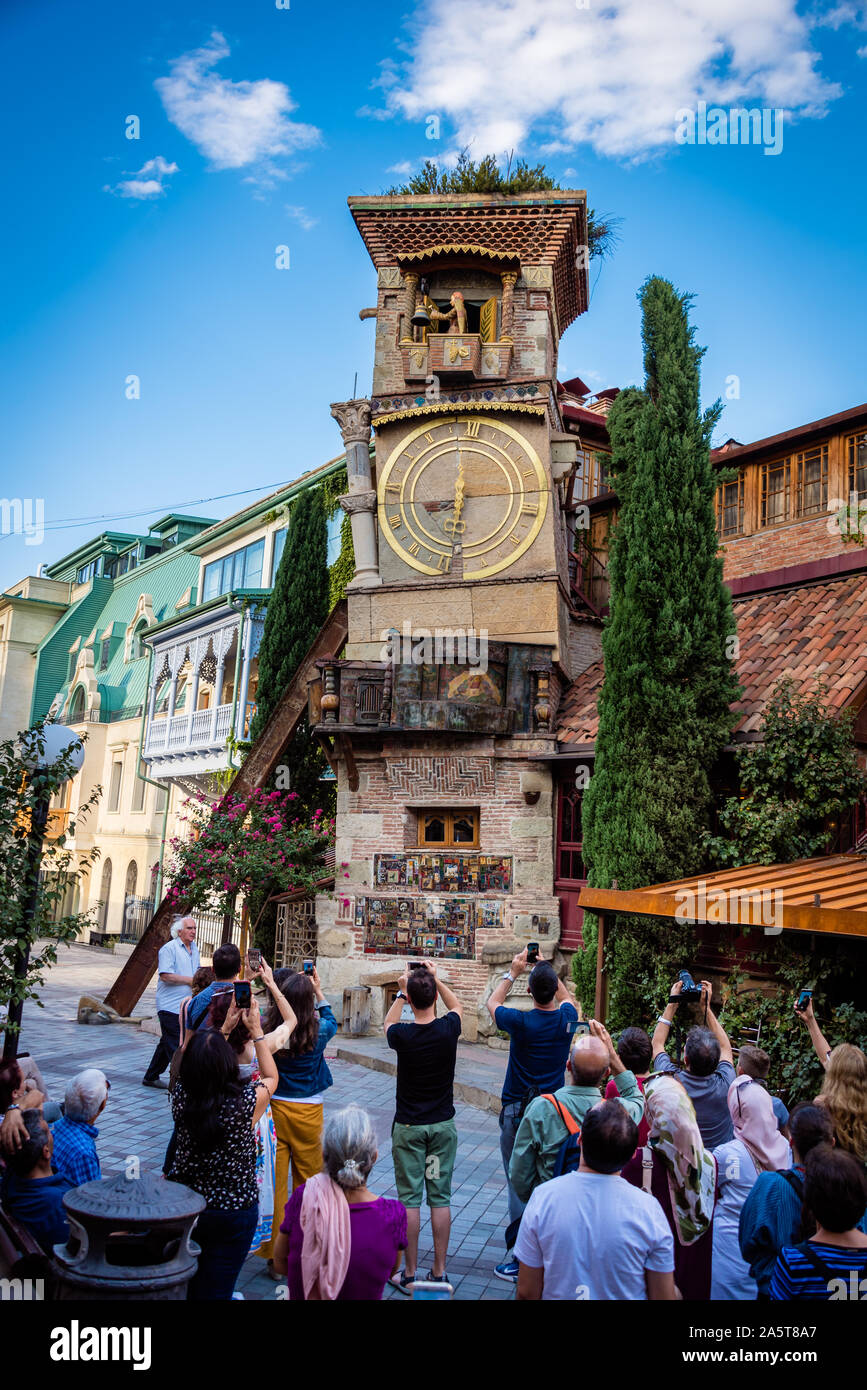 Tourist take photos of Leaning Clock Tower of Tbilisi, Georgia Stock ...