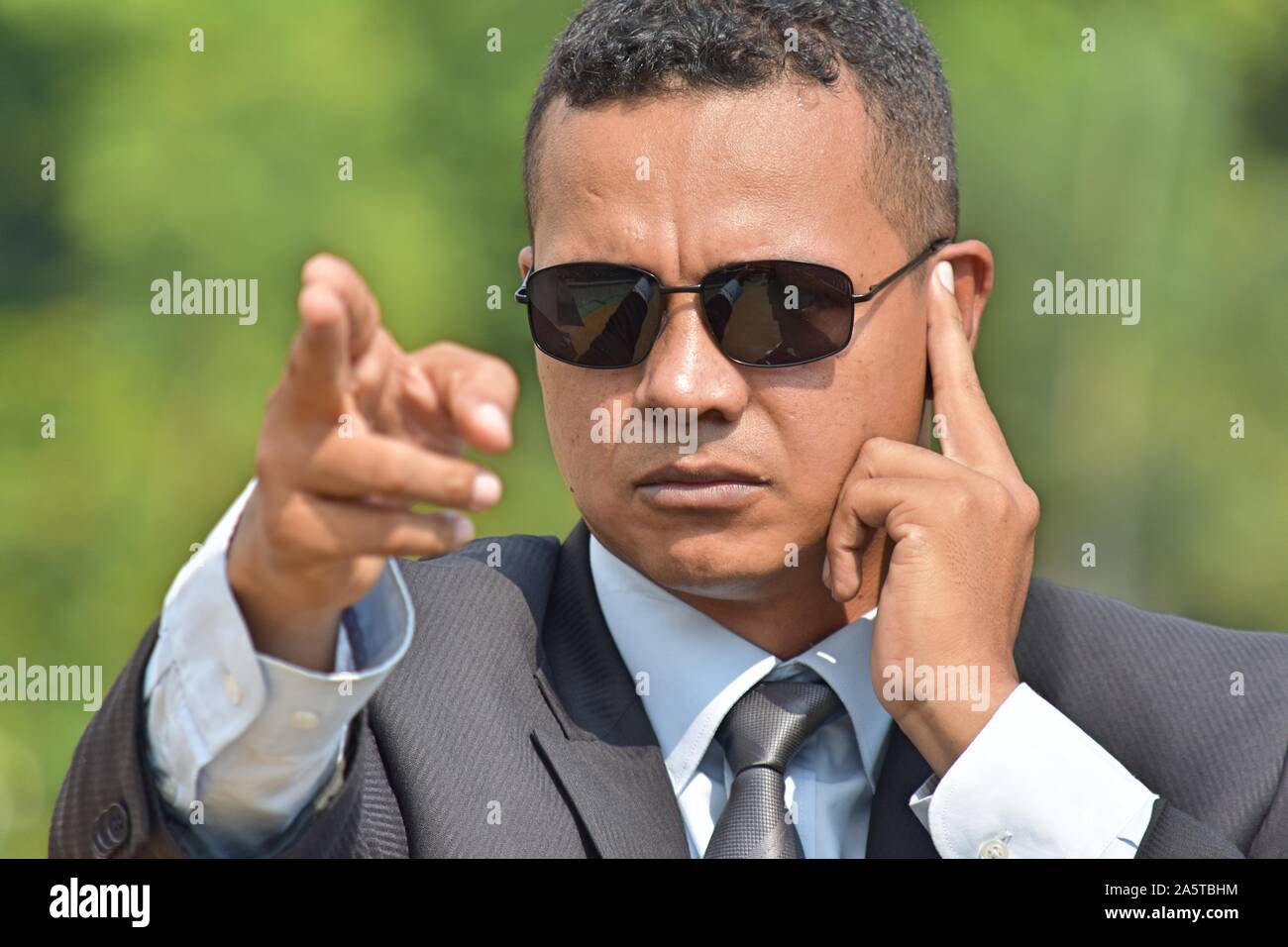 Pointing Handsome Security Guard Wearing Suit And Tie Stock Photo - Alamy