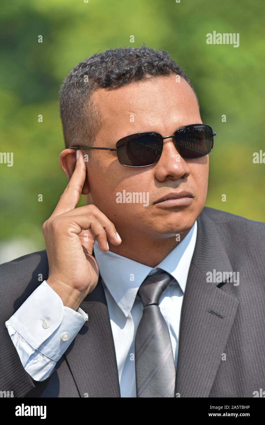 Colombian Security Guard Listening Stock Photo - Alamy