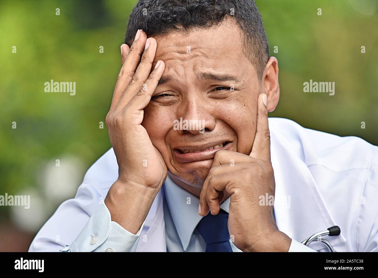 Crying Male Surgeon Wearing Lab Coat Stock Photo - Alamy