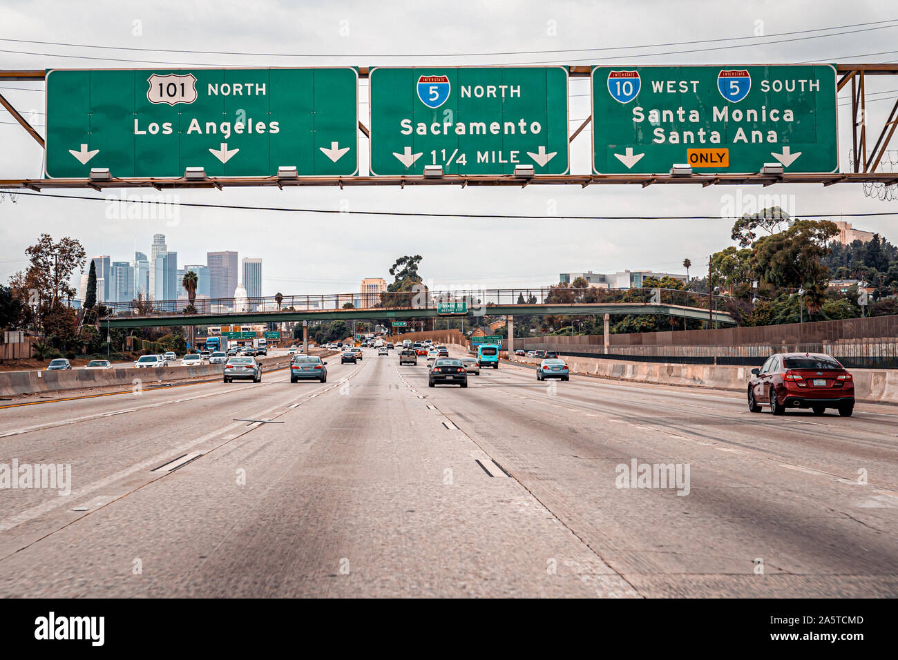 Highway towards downtown Los Angeles, California. Direction sign. Heavy ...