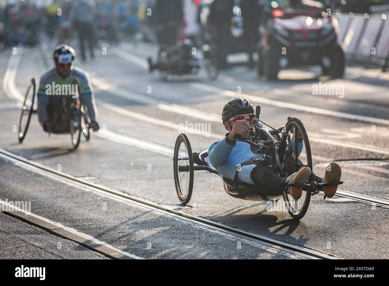 Disabled athlete in a sport wheelchair during marathon run, disabled ...