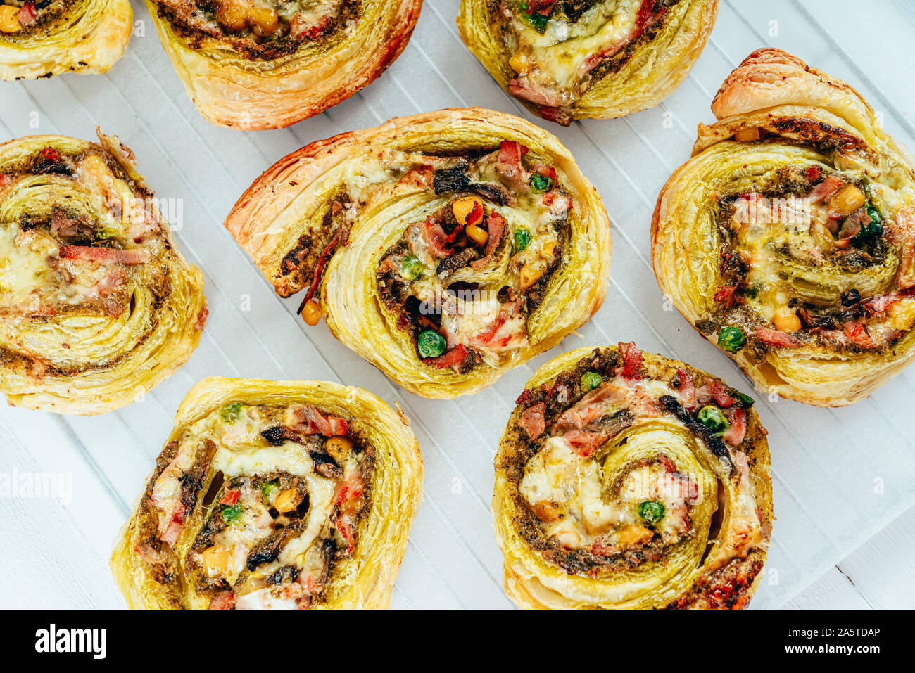 Green Pesto Pizza Swirl Wheels Stock Photo - Alamy