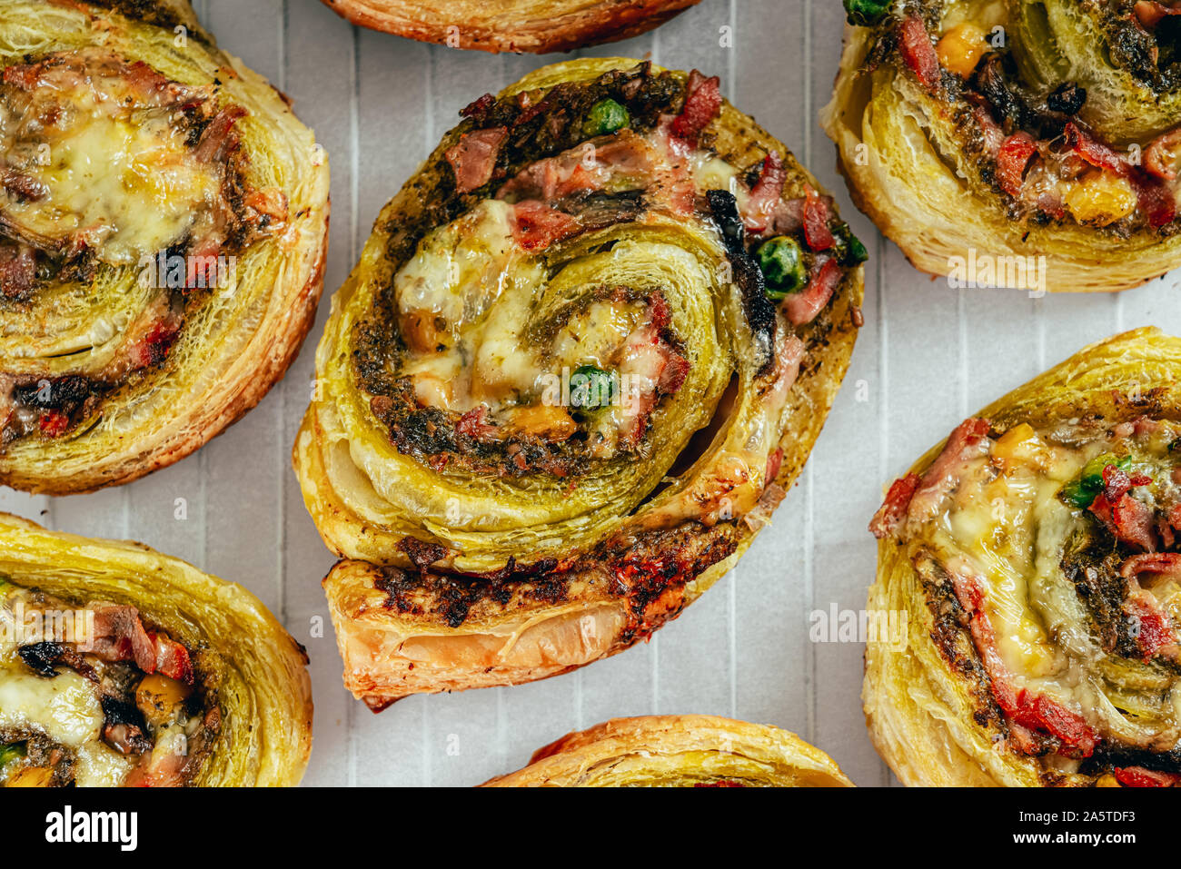 Green Pesto Pizza Swirl Wheels Stock Photo - Alamy